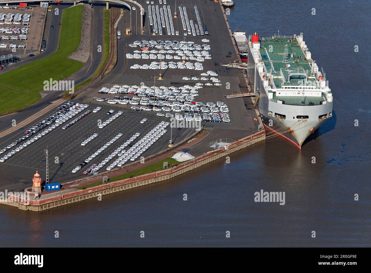 Aerial shot pier with cargo ship, new cars for loading, Emden, Lower ...