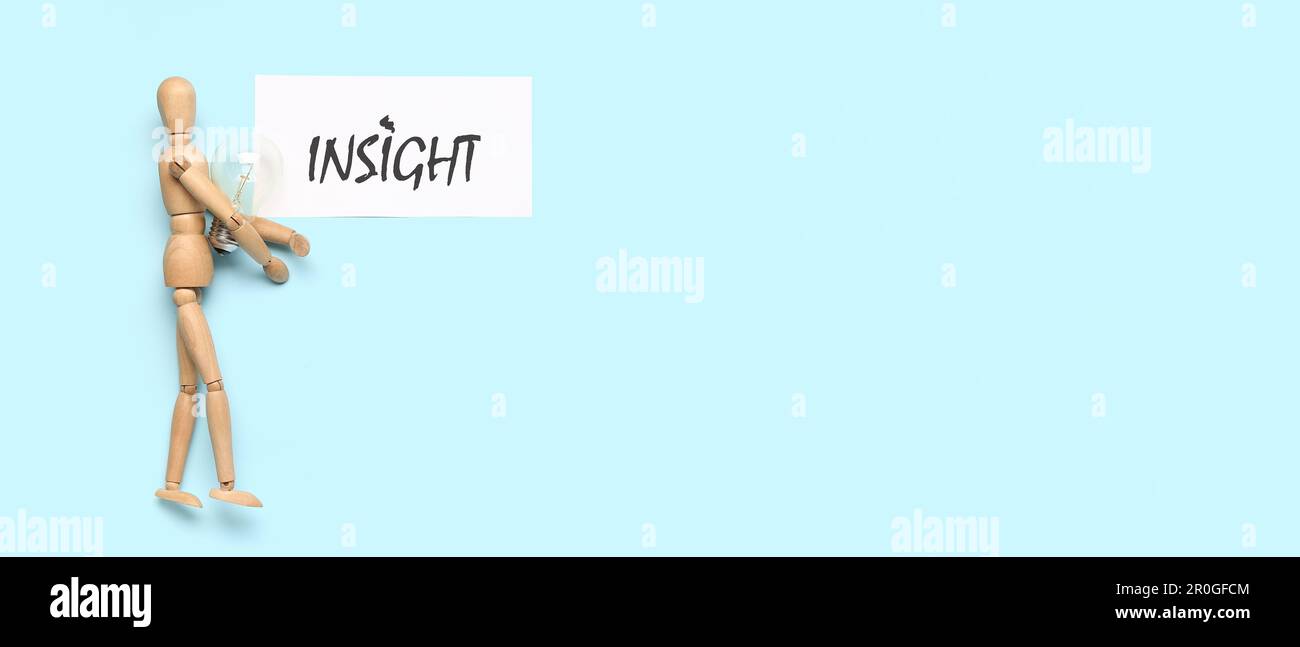 Paper with word INSIGHT, wooden human figurine and light bulb on blue ...