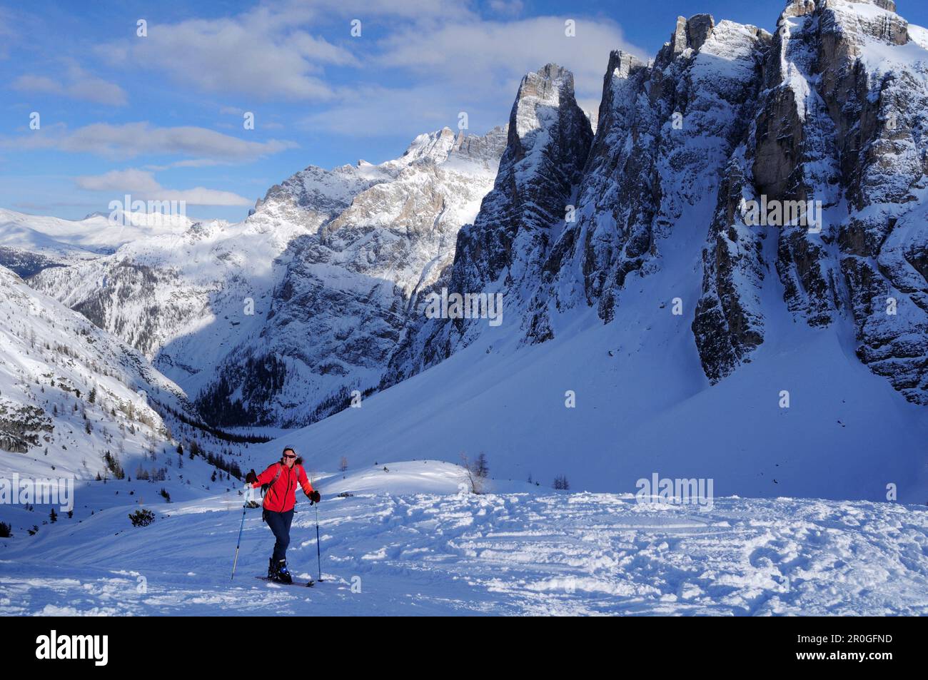Woman backcountry skiing ascending to Sextener Stein, Sextener ...