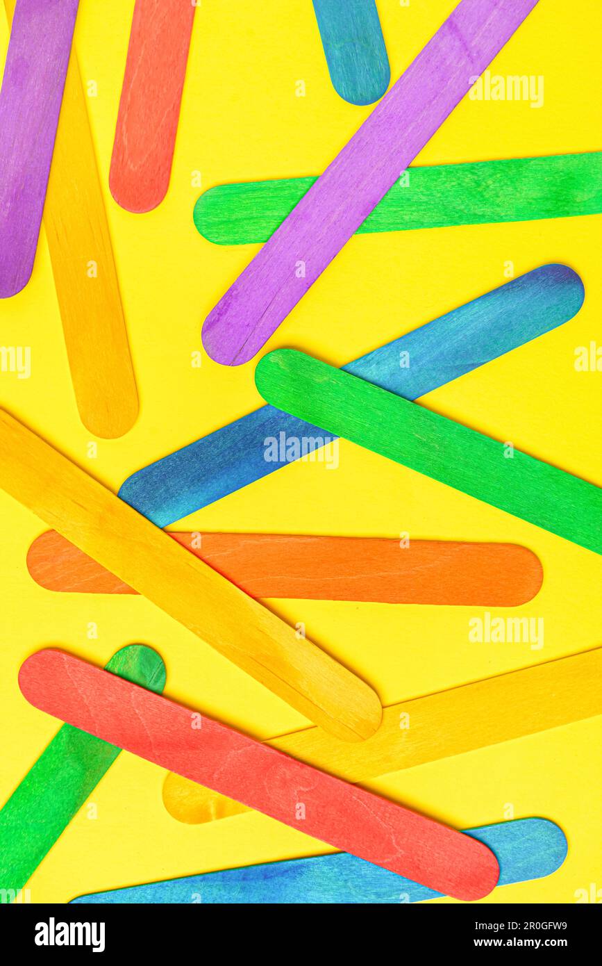 Colorful ice cream sticks on beige background Stock Photo - Alamy