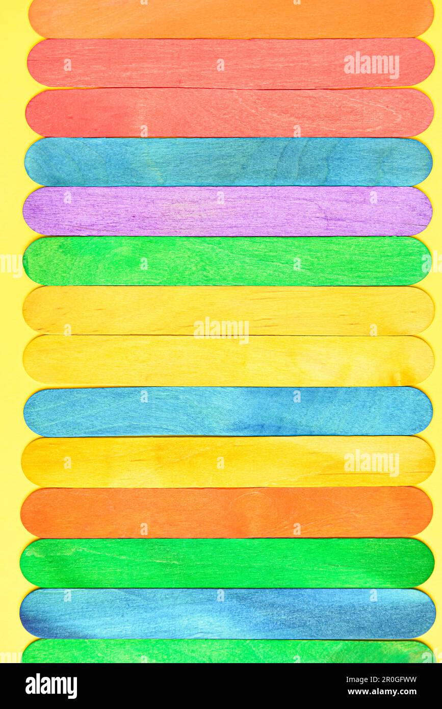 Colorful ice cream sticks on beige background Stock Photo - Alamy