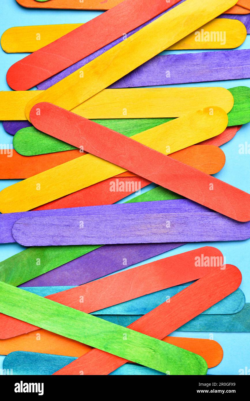 Colorful ice cream sticks on blue background Stock Photo - Alamy