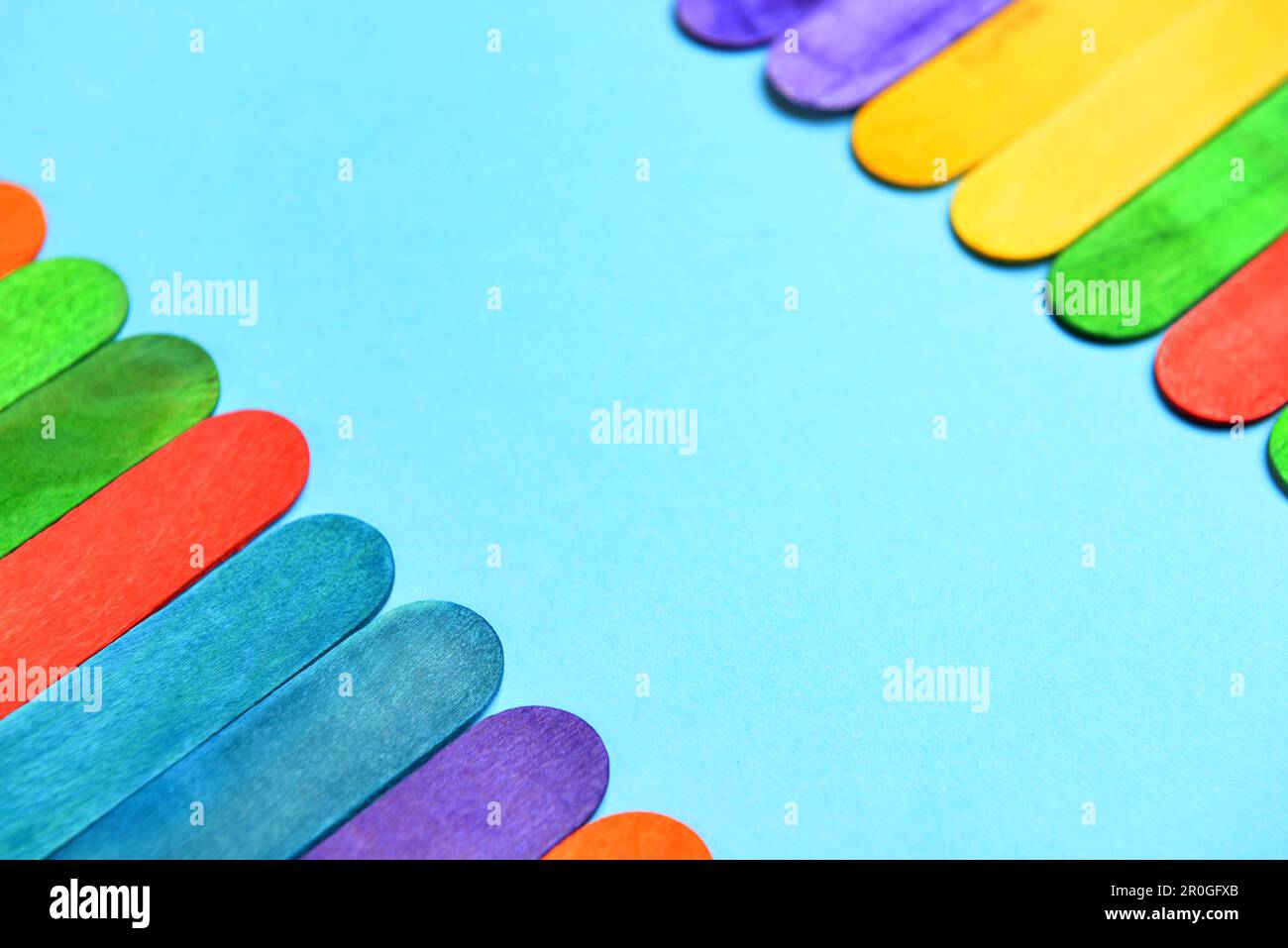 Colorful ice cream sticks on blue background Stock Photo - Alamy