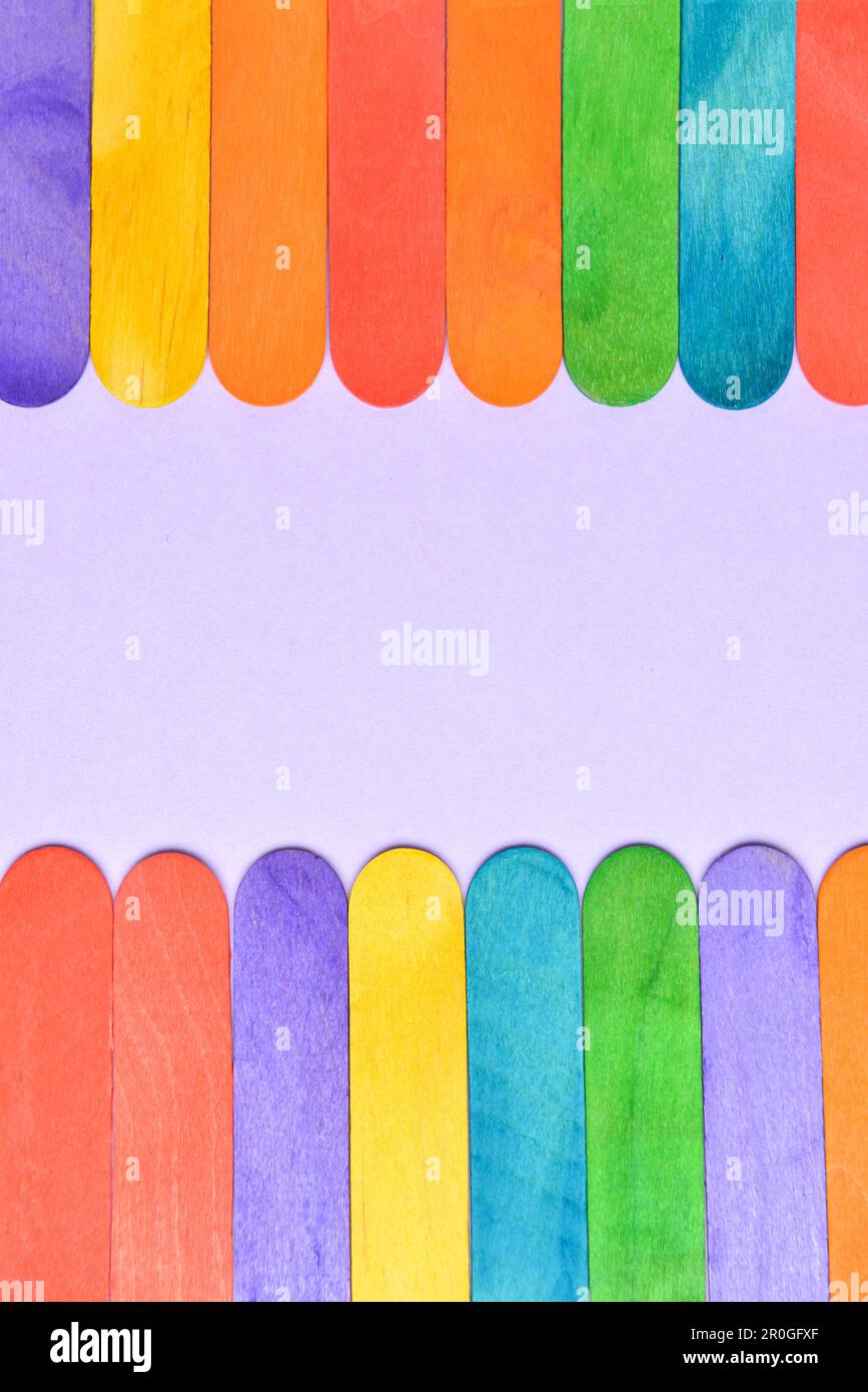 Colorful ice cream sticks on purple background Stock Photo - Alamy