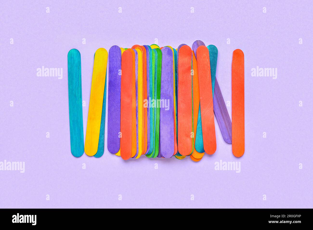 Colorful ice cream sticks on purple background Stock Photo - Alamy