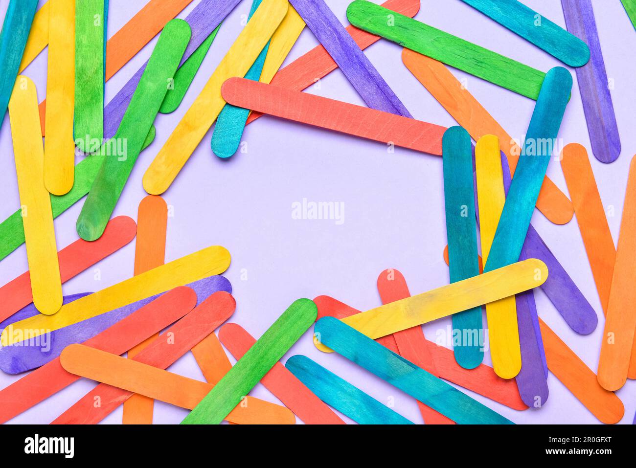 Frame made of colorful ice cream sticks on purple background Stock ...