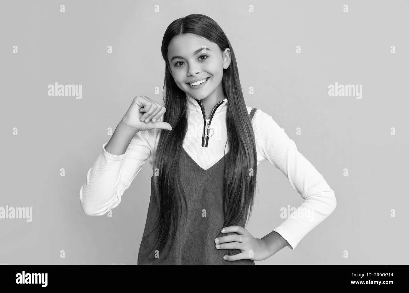 glad child with long hair on yellow background Stock Photo - Alamy