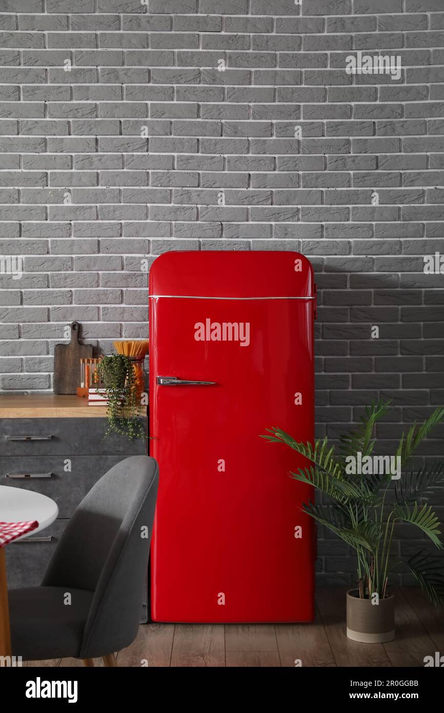 Stylish refrigerator in interior of modern kitchen Stock Photo - Alamy