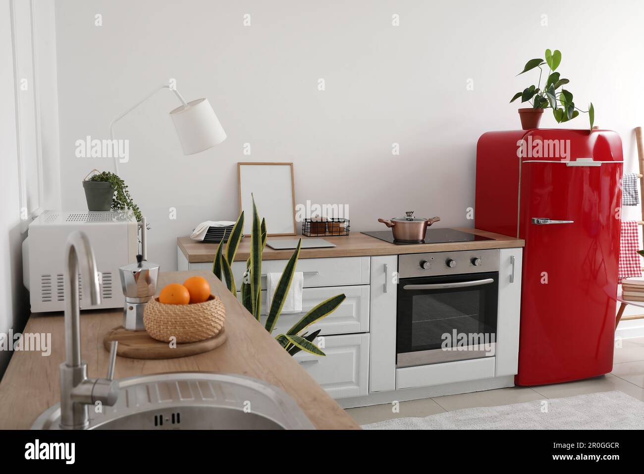 Interior of modern kitchen with stylish refrigerator Stock Photo - Alamy