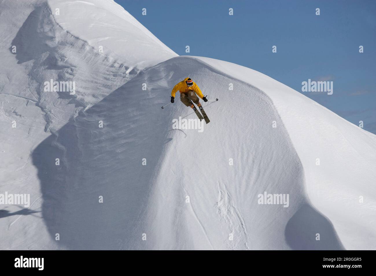 Skier jumping from snow cornice, Pischa, Davos, Canton of Grisons ...