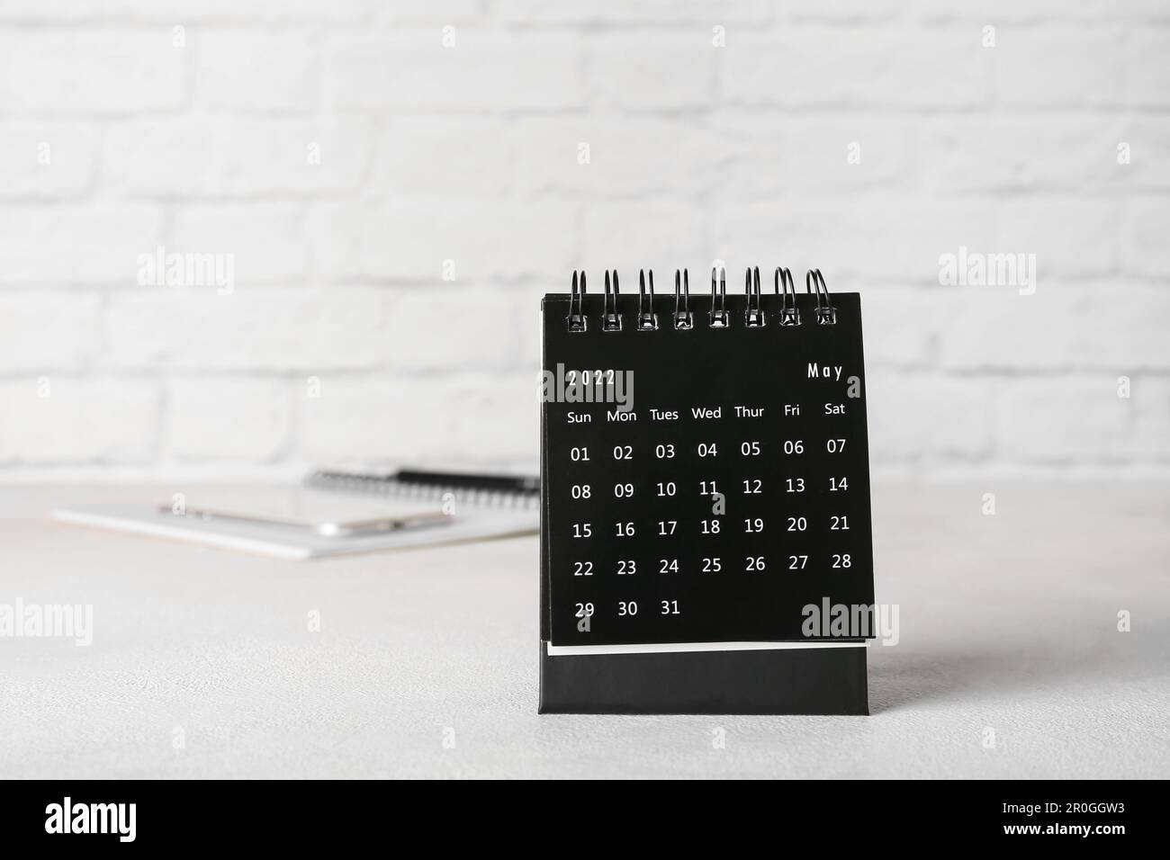 Flip calendar for May on light background Stock Photo - Alamy