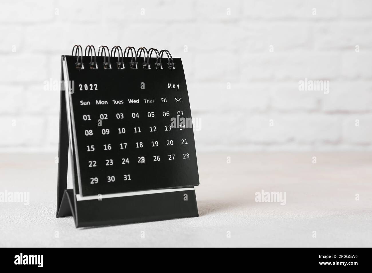 Flip calendar for May on light background Stock Photo - Alamy