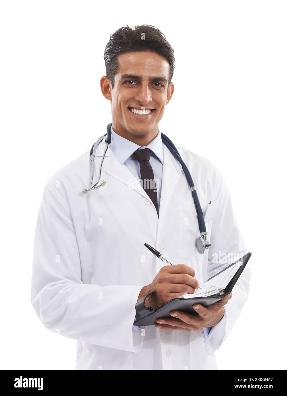 Planning his week. Portrait of a handsome young doctor writing in his ...