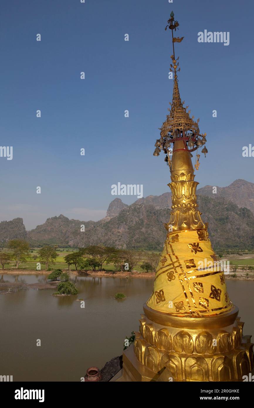 View from the Kyauk Ka Lat Pagoda on a rock, golden stupa in front of ...