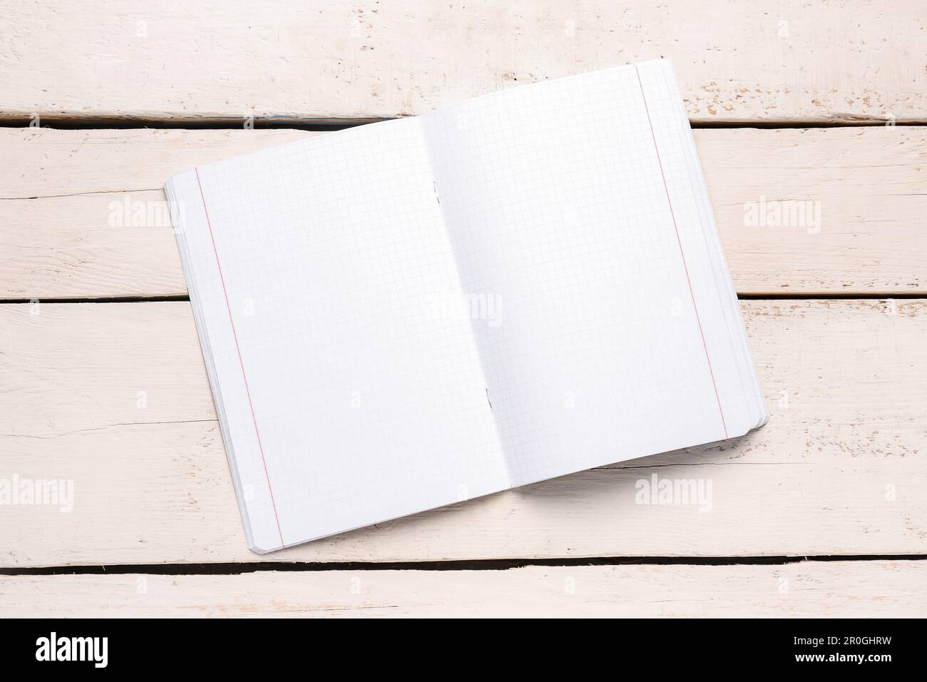 Blank copybook pages on white wooden background Stock Photo - Alamy
