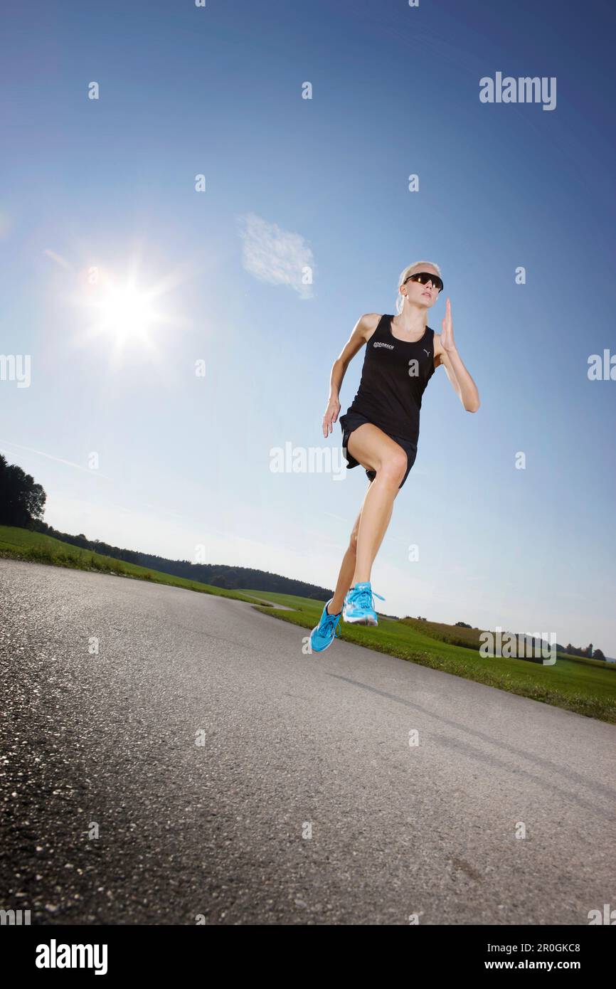 Female runner back low angle hi-res stock photography and images - Alamy