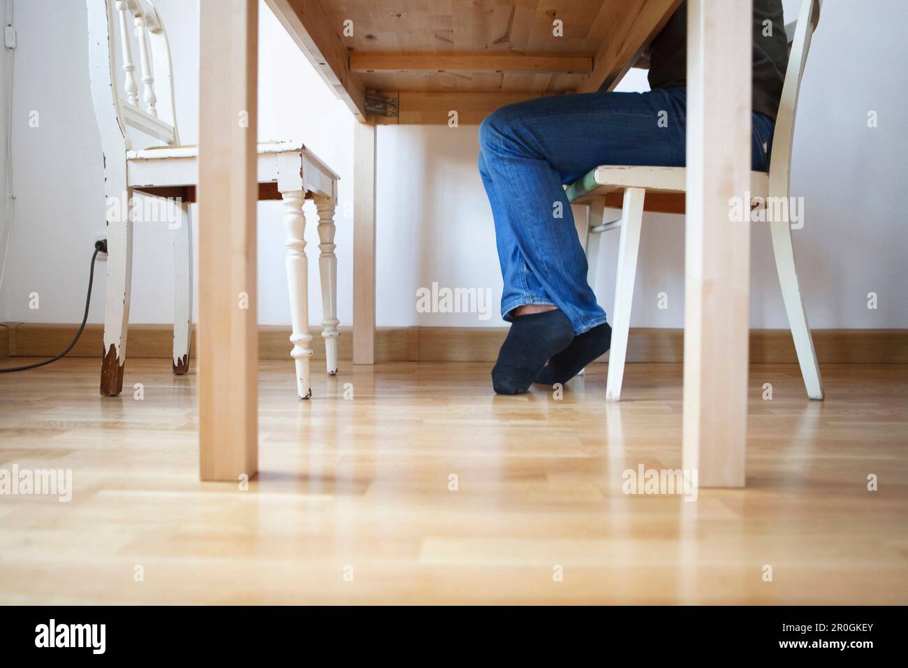 Man sitting at table hi-res stock photography and images - Alamy