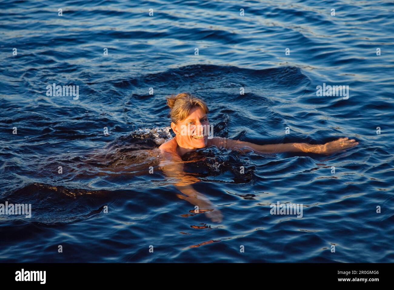 Mature woman swimming in lake Boasjon, Smaland, Sweden Stock Photo - Alamy
