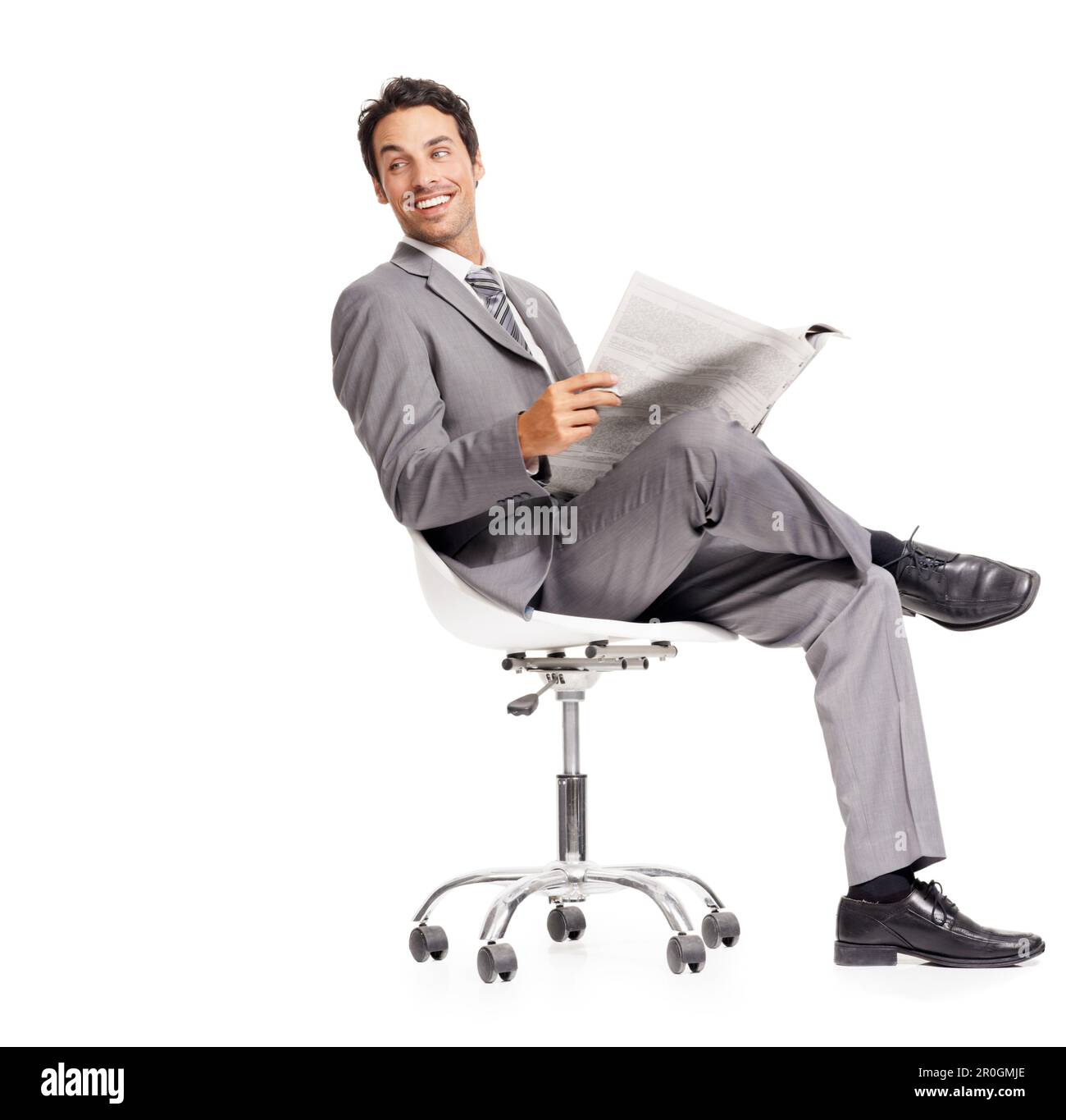 You see are stocks are rising. A smiling young executive looking over ...