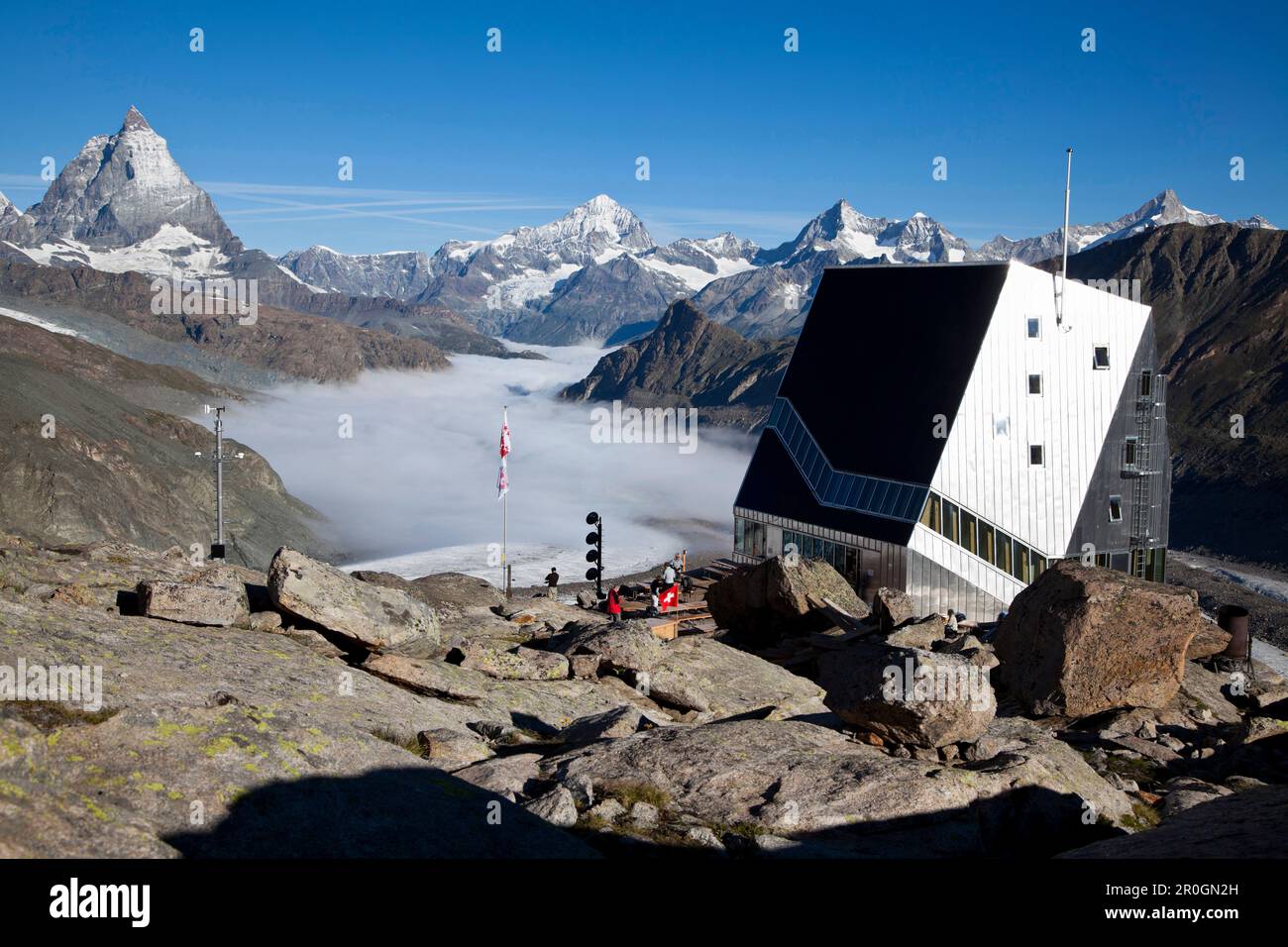 View over Monte-Rosa-Hut and Gorner glacier in early morning fog to ...
