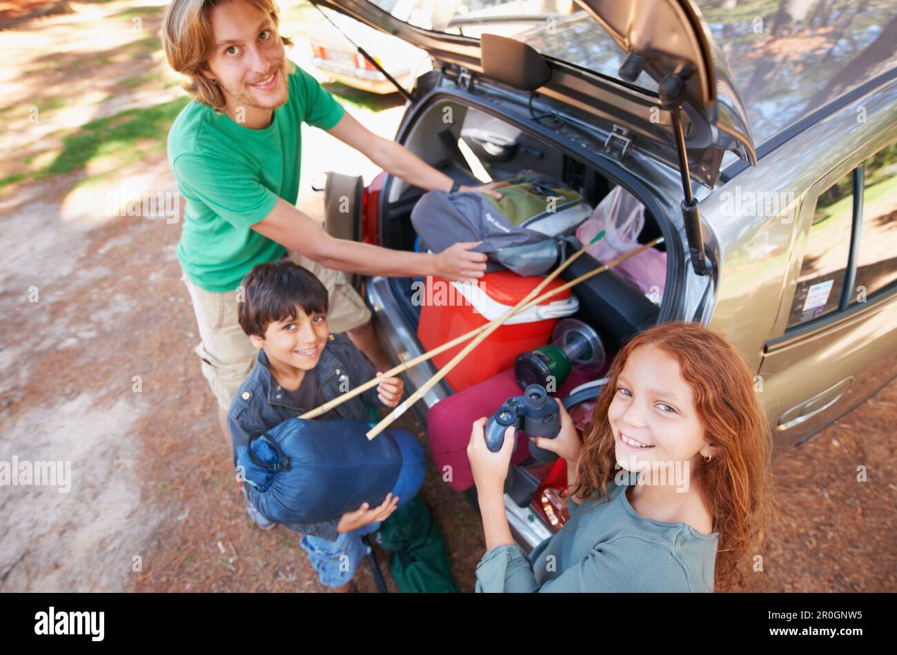 Happy family, portrait and packing car above for holiday, road trip or ...