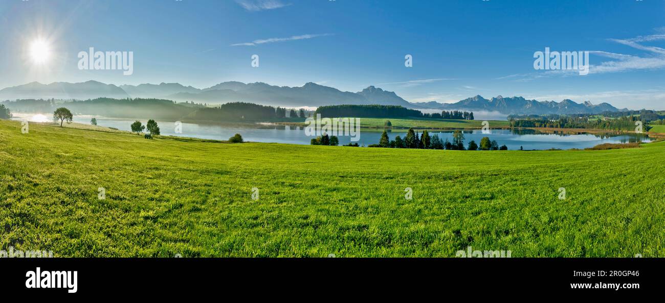 Scenery at lake Forggensee and view of Fuessener mountains, East ...
