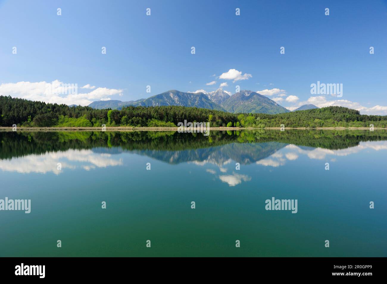 Karawanken range reflecting in lake Turnersee, lake Turnersee ...