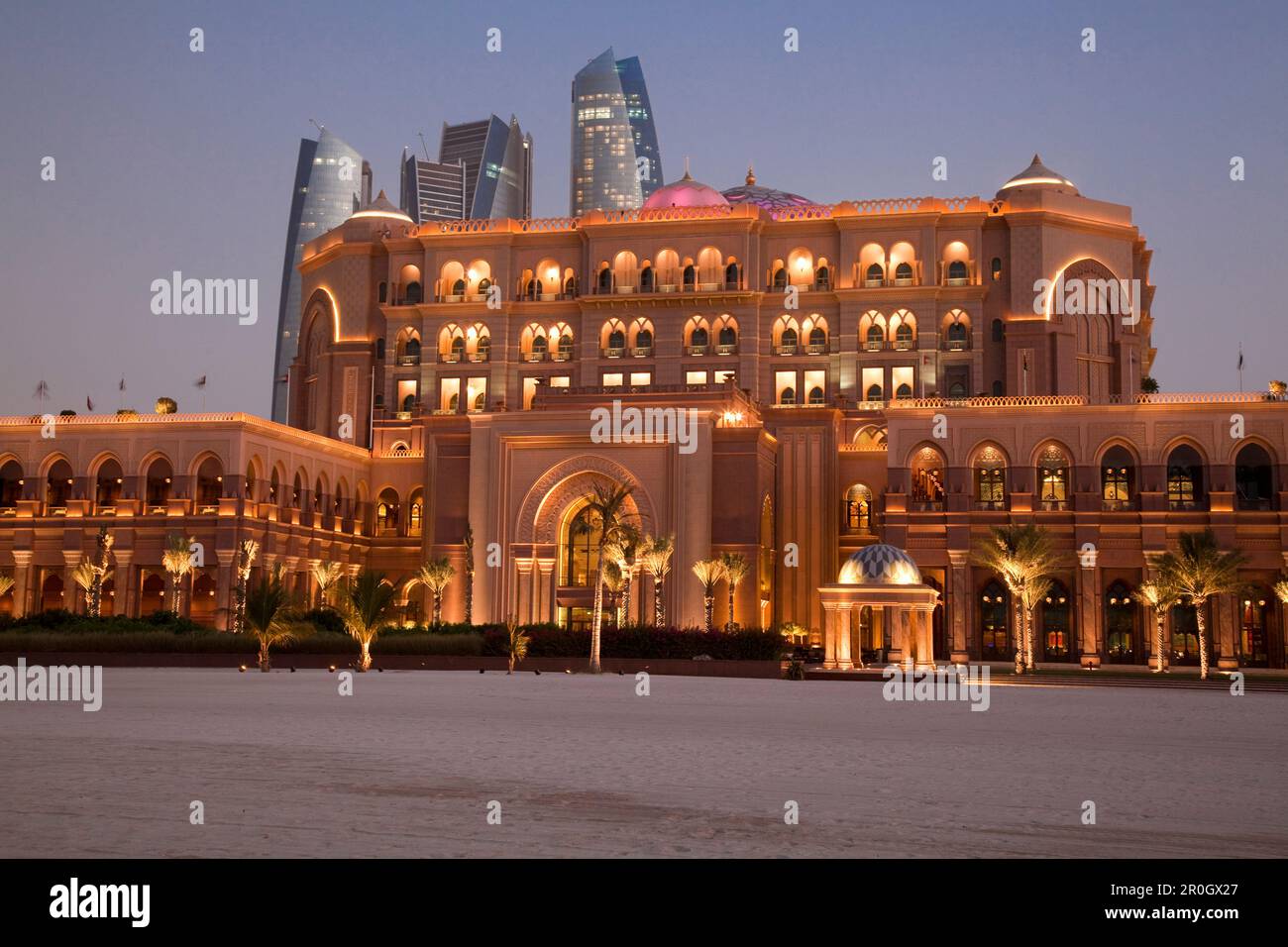 Emirates Palace hotel and high-rise buildings at dusk, Abu Dhabi ...