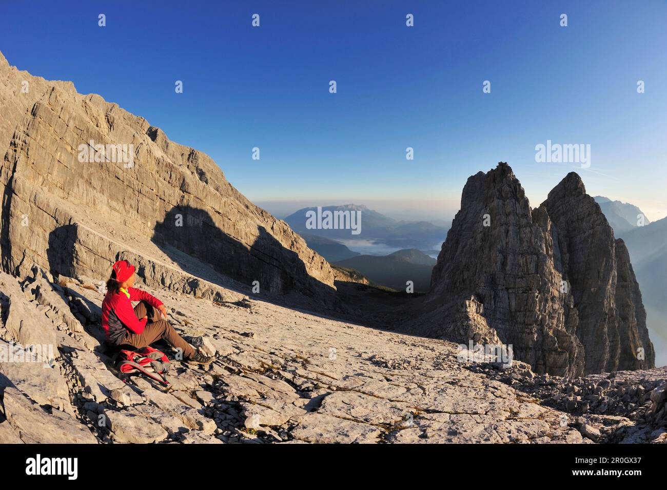 Woman sitting at Third Watzmannkind, Watzmann Mittelspitze, Fourth ...