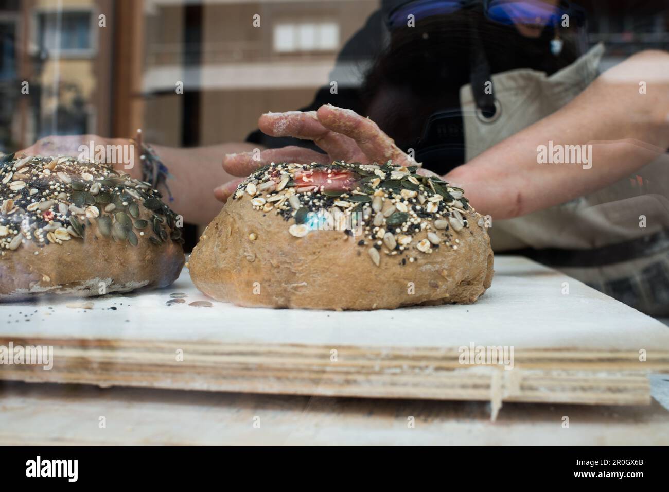 Raw bread ready to be baked in the oven. Unrecognizable woman Stock ...
