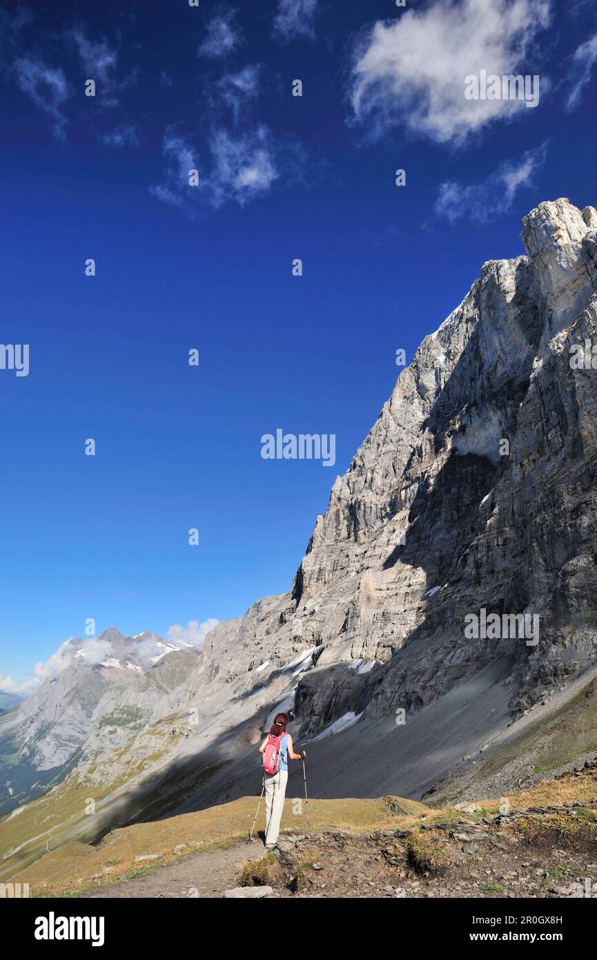 Woman hiking on Eiger-Trail, Eiger North Face, UNESCO World Heritage ...