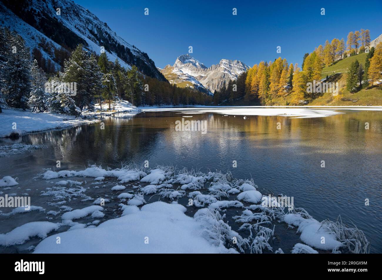 Reflection of mountains in Lake Palpuoga, Bergun, Grisons, Switzerland ...