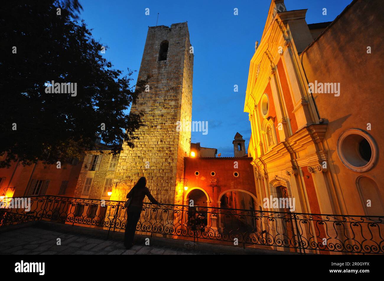 The illuminated Chateau Grimaldi at the old town in the evening ...