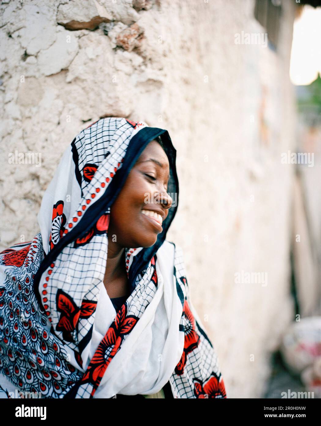 Woman wearing Kanga, in Jambiani village, southeast, Zanzibar, Tanzania ...
