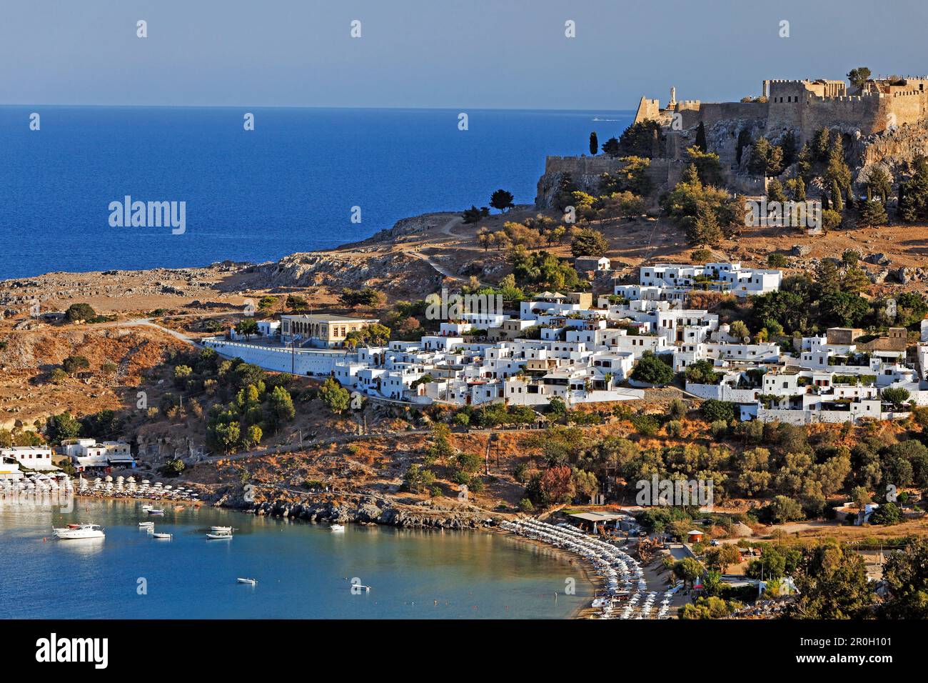View of Pallas Beach and the remains of the acropolis, Lindos, Rhodes ...