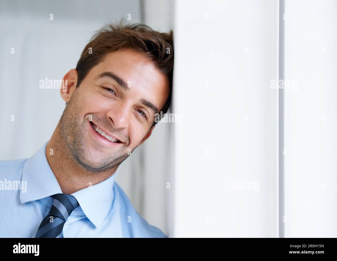 The modern professional. a handsome young businessman at work Stock ...