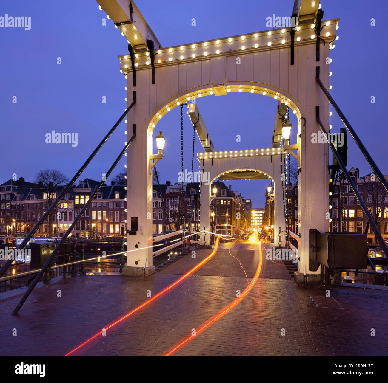 Magere Brug over the river Amstel at dusk, Amsterdam, North Holland ...
