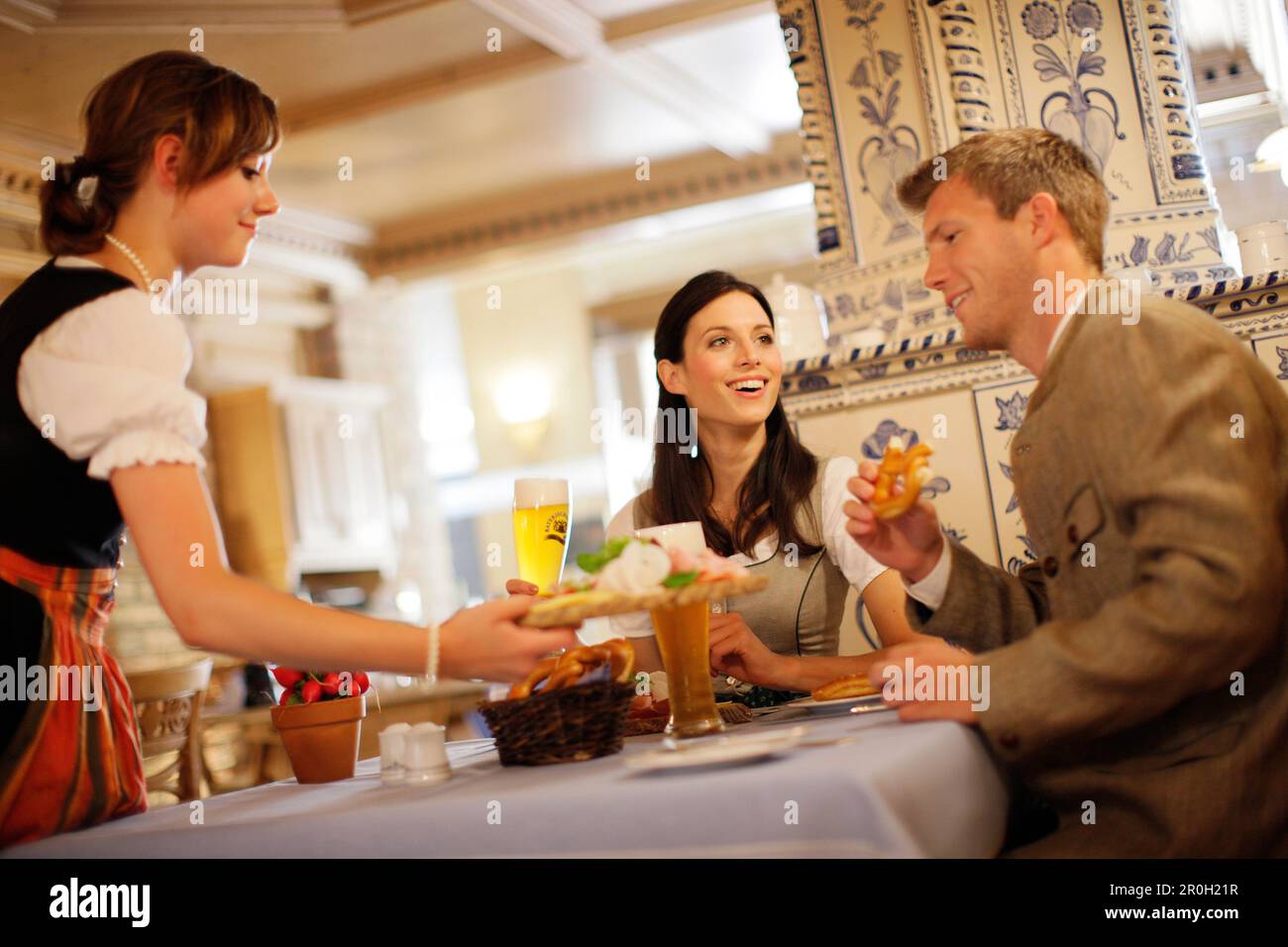 People having a snack in a restaurant Stock Photo - Alamy