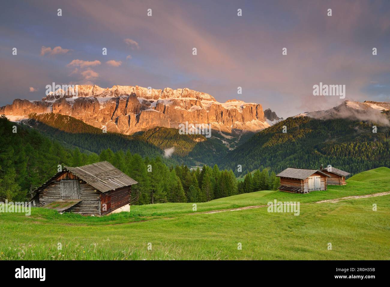 Hay barn in front of the Sella range with alpenglow, Val Gardena ...