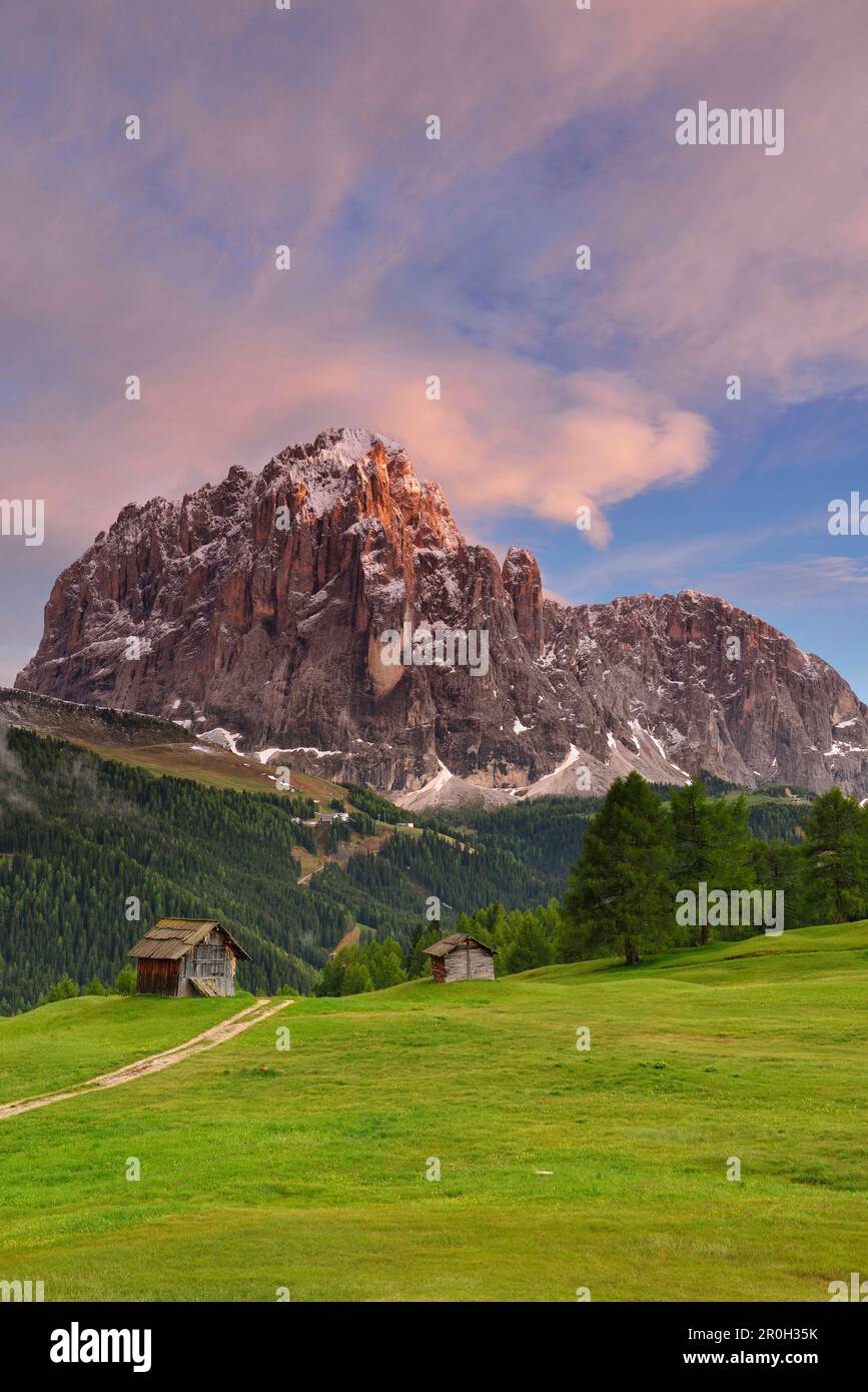 Hay barn in front of Langkofel range in alpenglow, Val Gardena ...