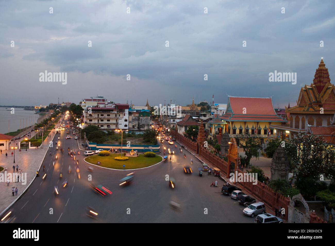 Sisowath Quay at the riverside of Tonle Saps River with Wat Ouna, Phnom ...