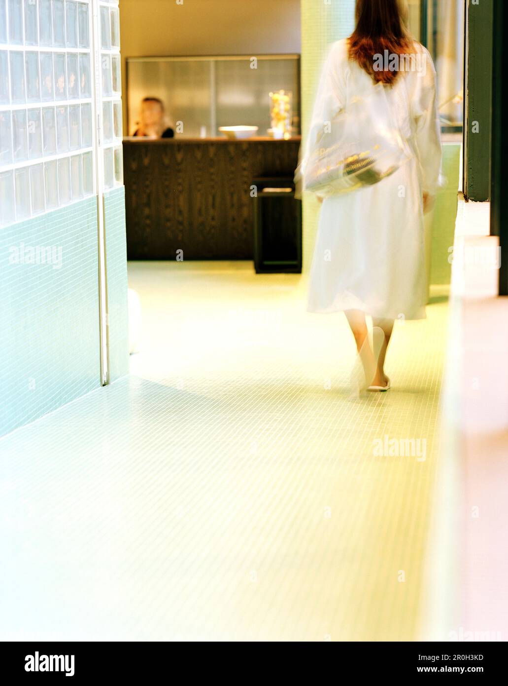 Woman in spa with robe walking hi-res stock photography and images - Alamy
