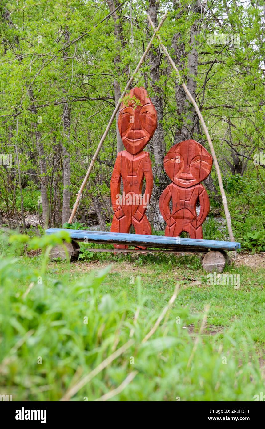Wooden sculptures of aboriginal people, natives, in an Itelmen village ...