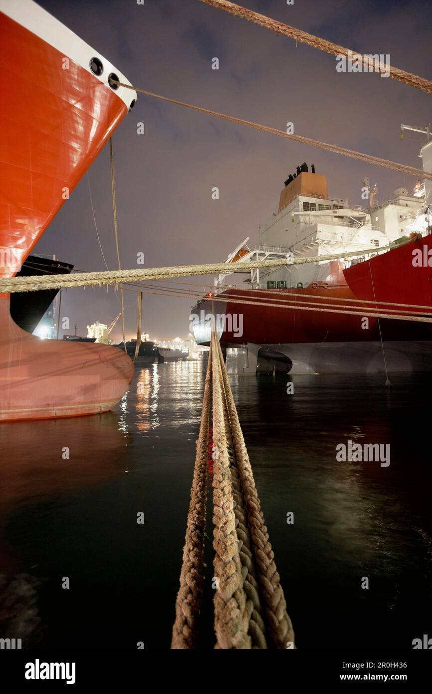 Container ships tied with ropes to the quay, dockyard, Ulsan, South ...