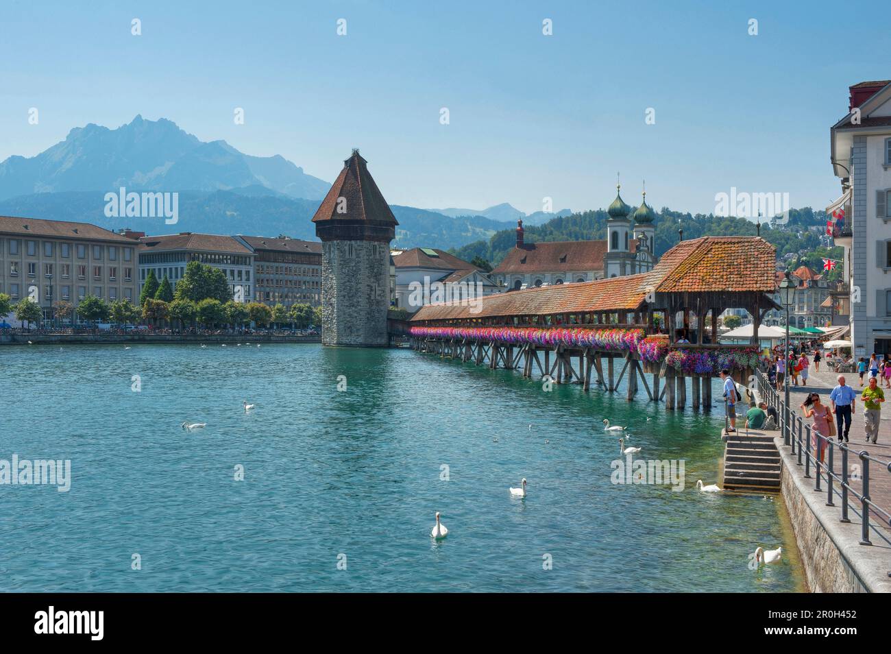View of Chapel bridge with water tower and Pilatus mountain, Lucerne ...