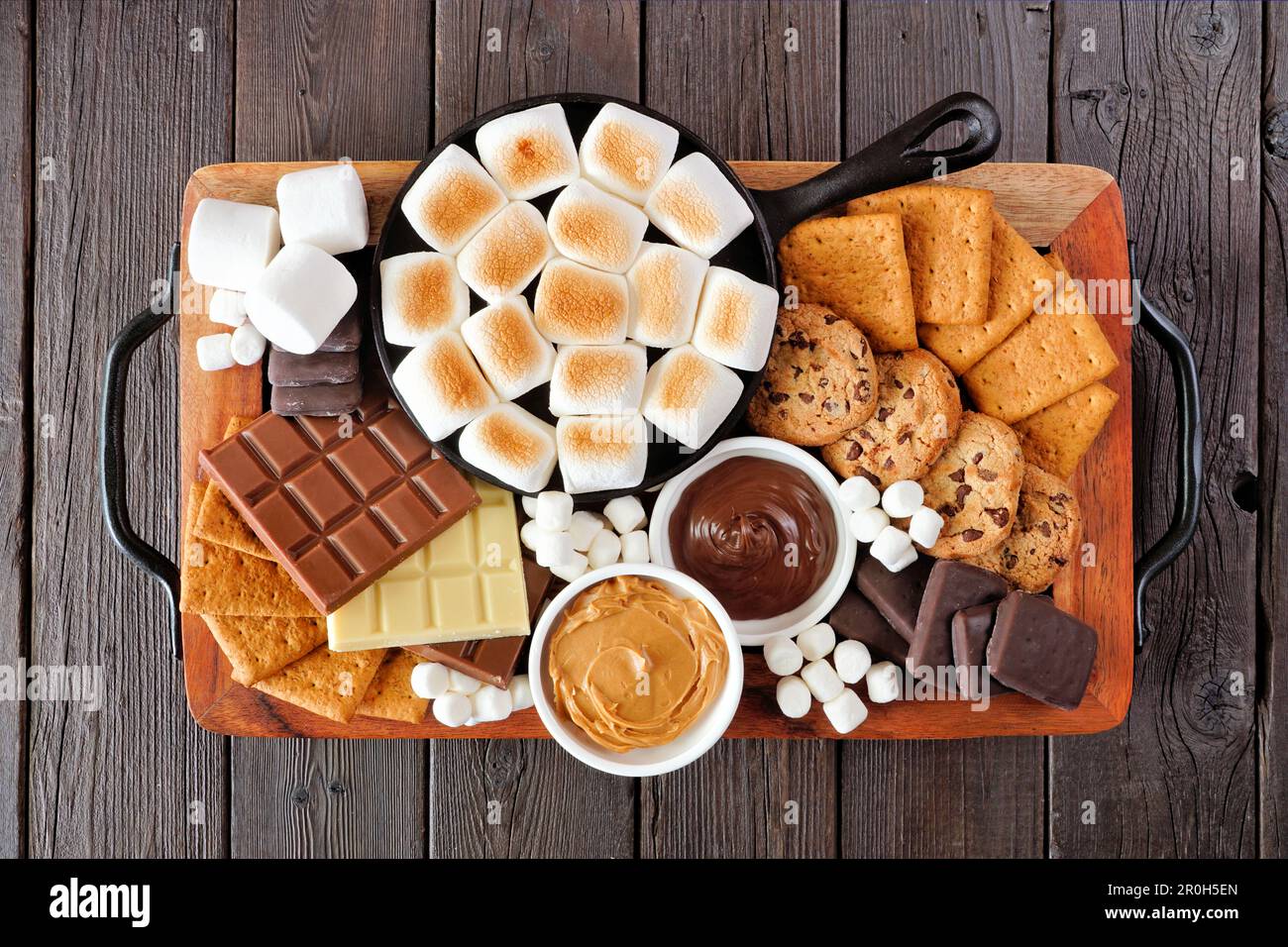 Smores platter. Roasted marshmallows, crackers, chocolate and a group ...