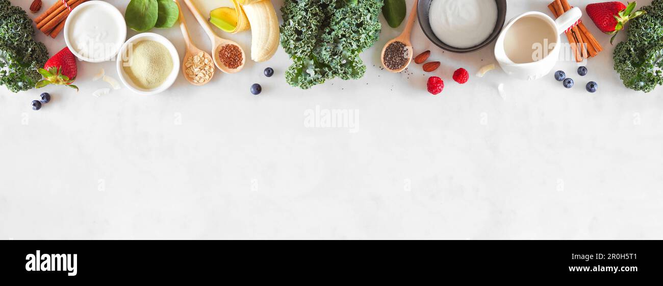 Healthy food top border. Smoothie making concept. Above view on a white ...