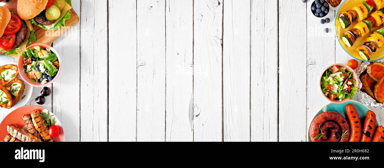 Summer BBQ or picnic food double border. Assorted burgers, grilled meat ...