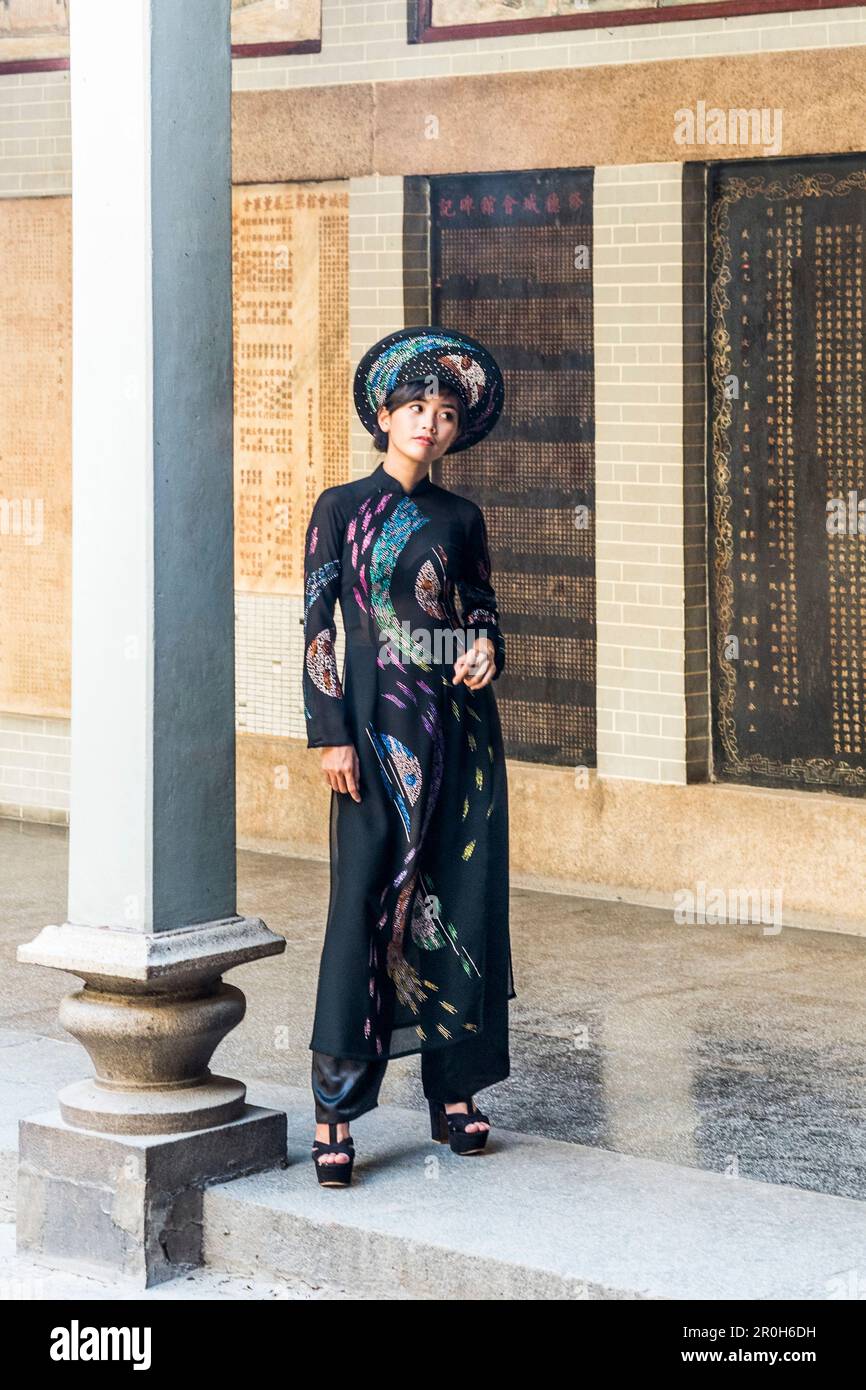 Young woman wearing fashionable traditional clothes in the Thien Hau ...