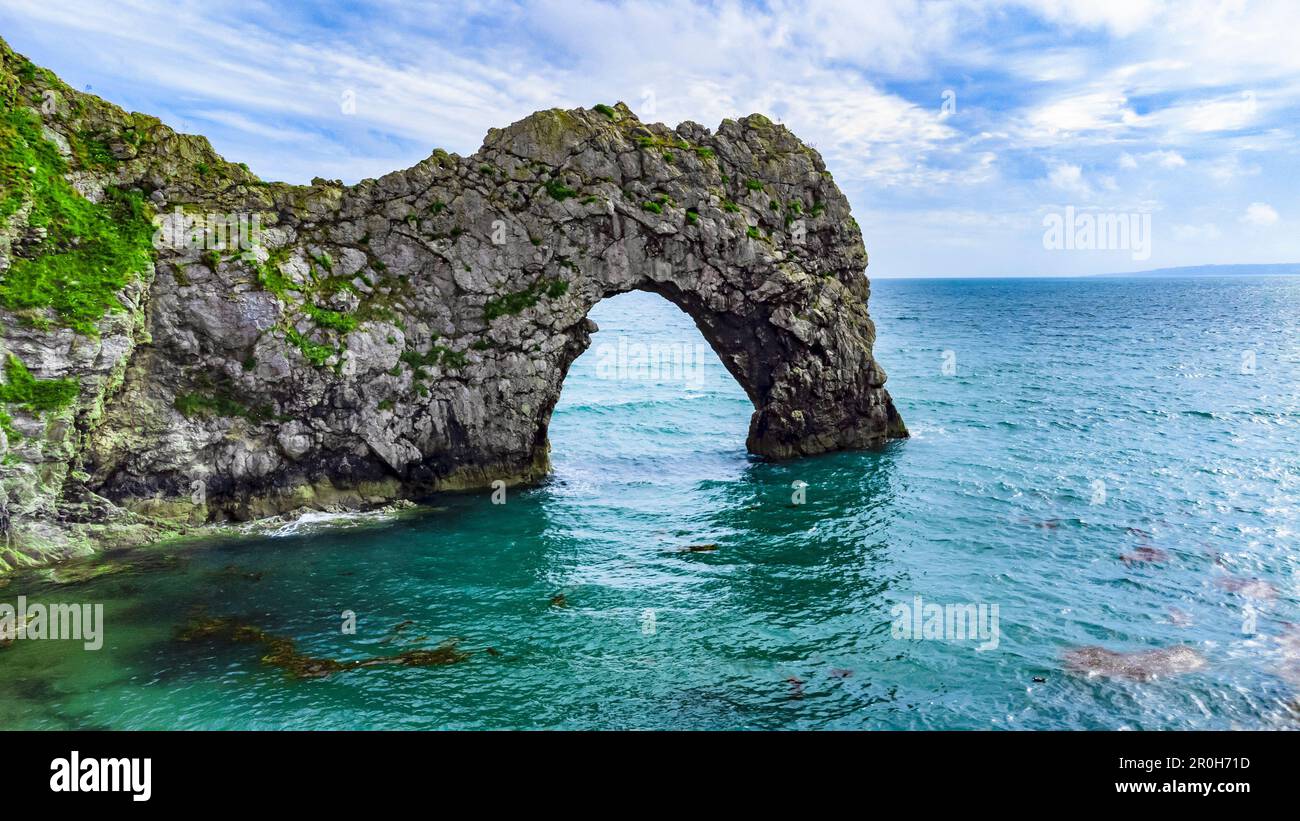 A picture of Durdle Door, a natural limestone arch situated on Man O ...